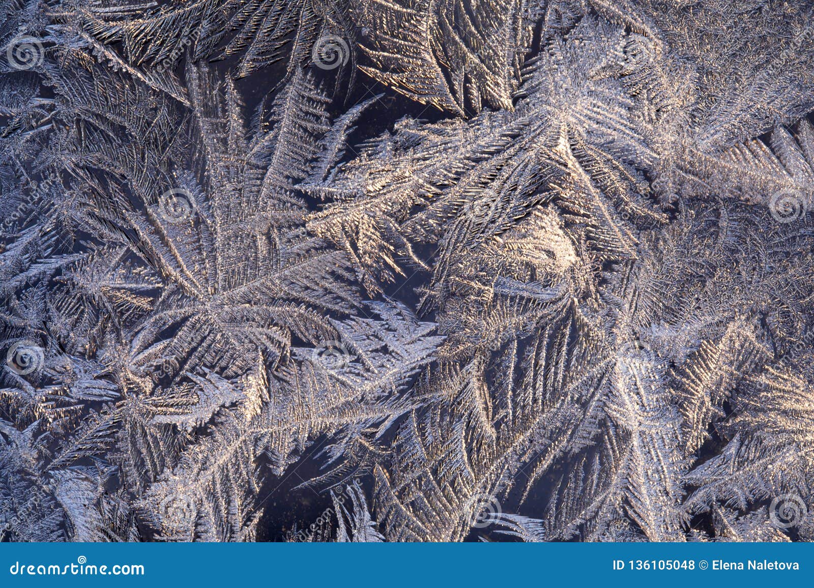 Frosty Pattern on a Window Glass on a Blue Background Stock Photo ...