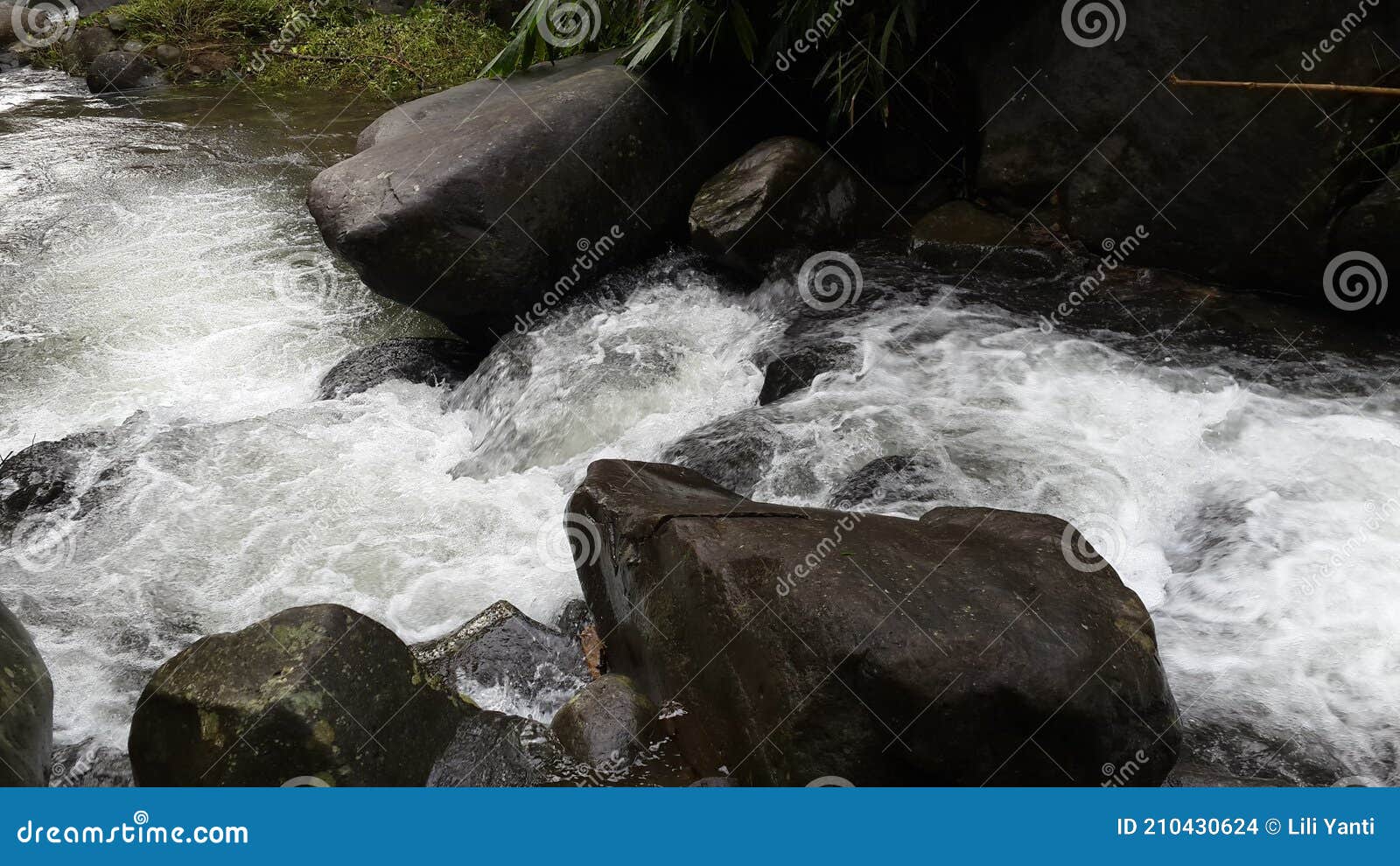 Froth Fresh and Clear Water through a Large Rock in the Middle of a ...