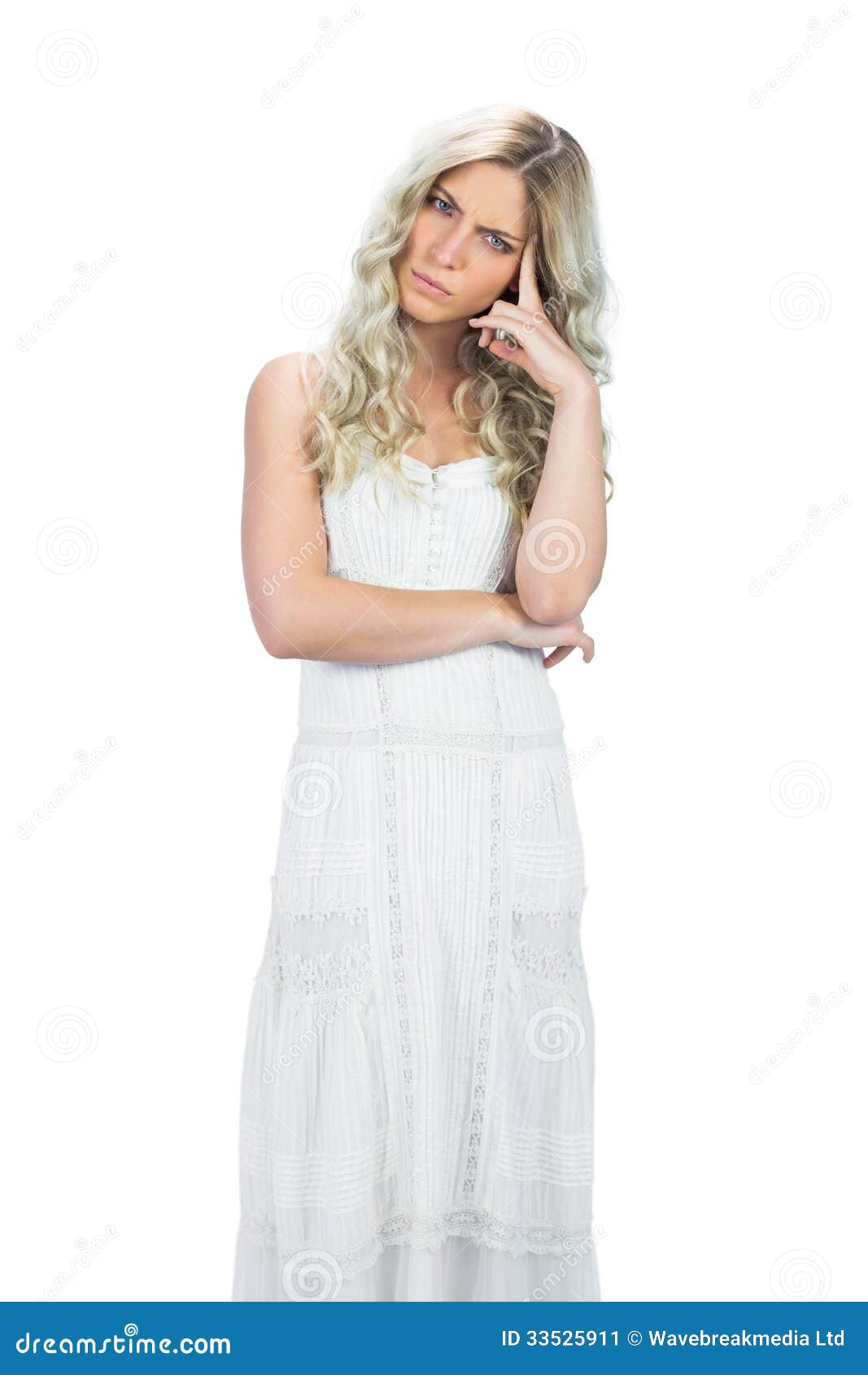Frowning Attractive Model in White Dress Posing Touching Her Head Stock ...