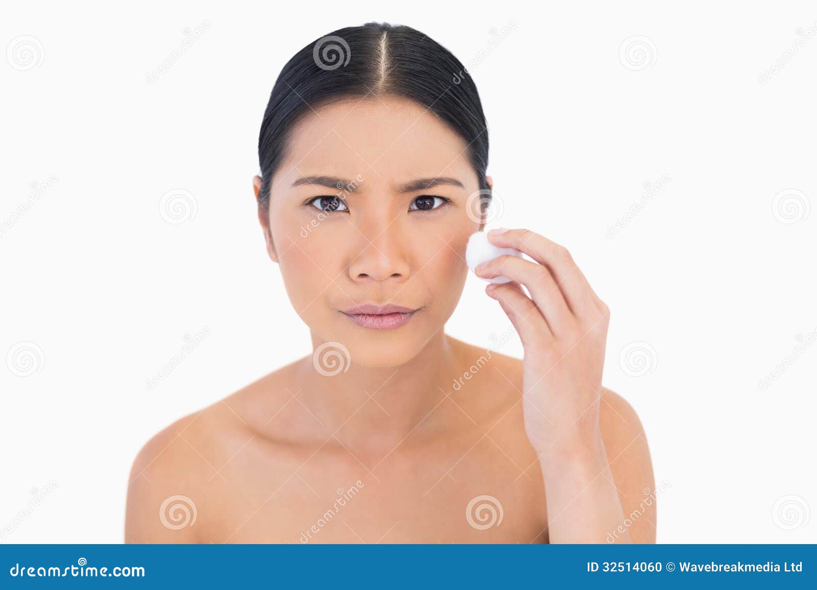Frowning Beautiful Model Using Cotton Pad on Her Face Stock Photo ...