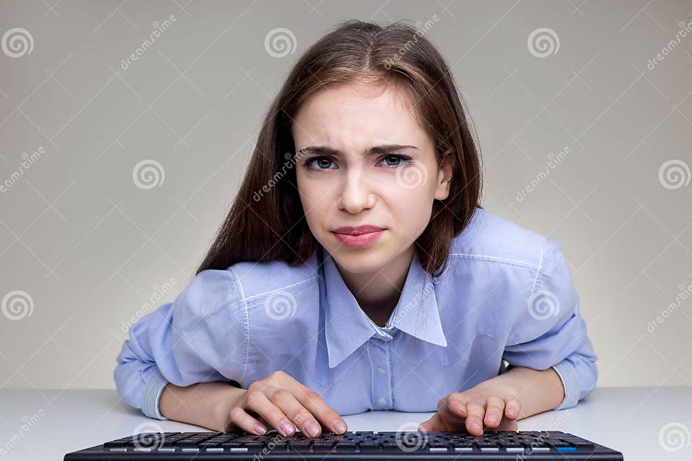 Frowning Female Using Keyboard Stock Photo - Image of information ...