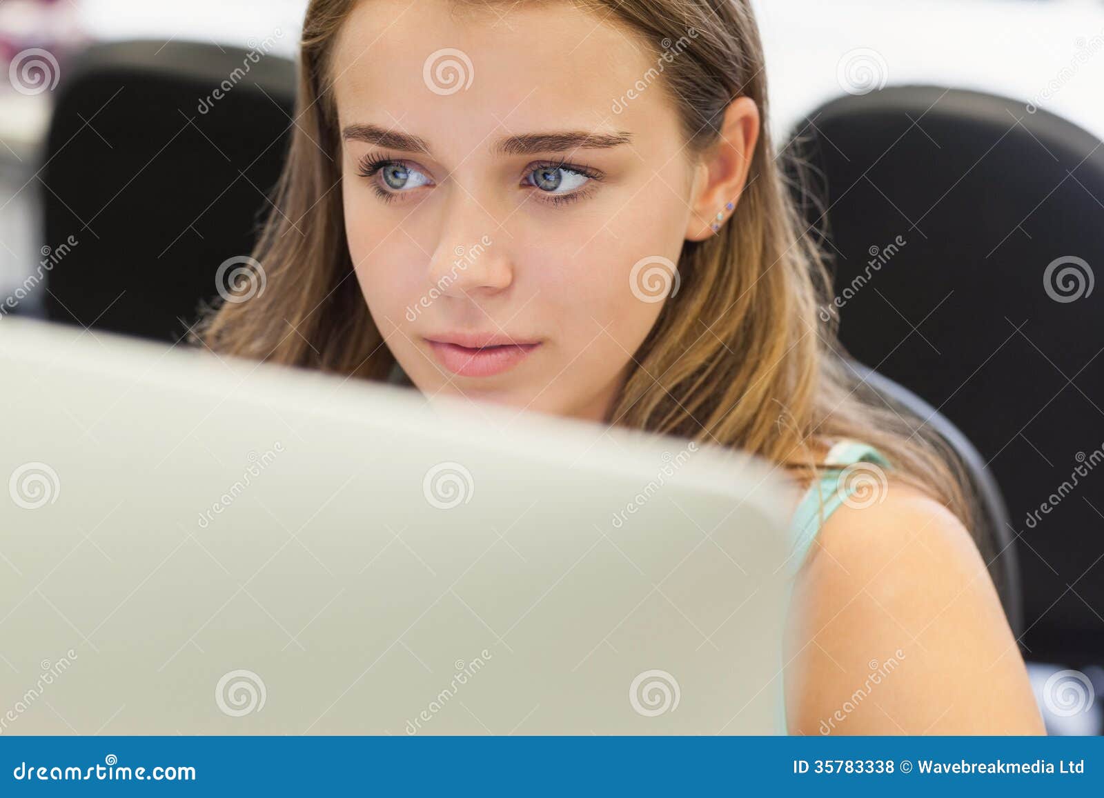Frowning Pretty Student Working on Computer Stock Photo - Image of ...