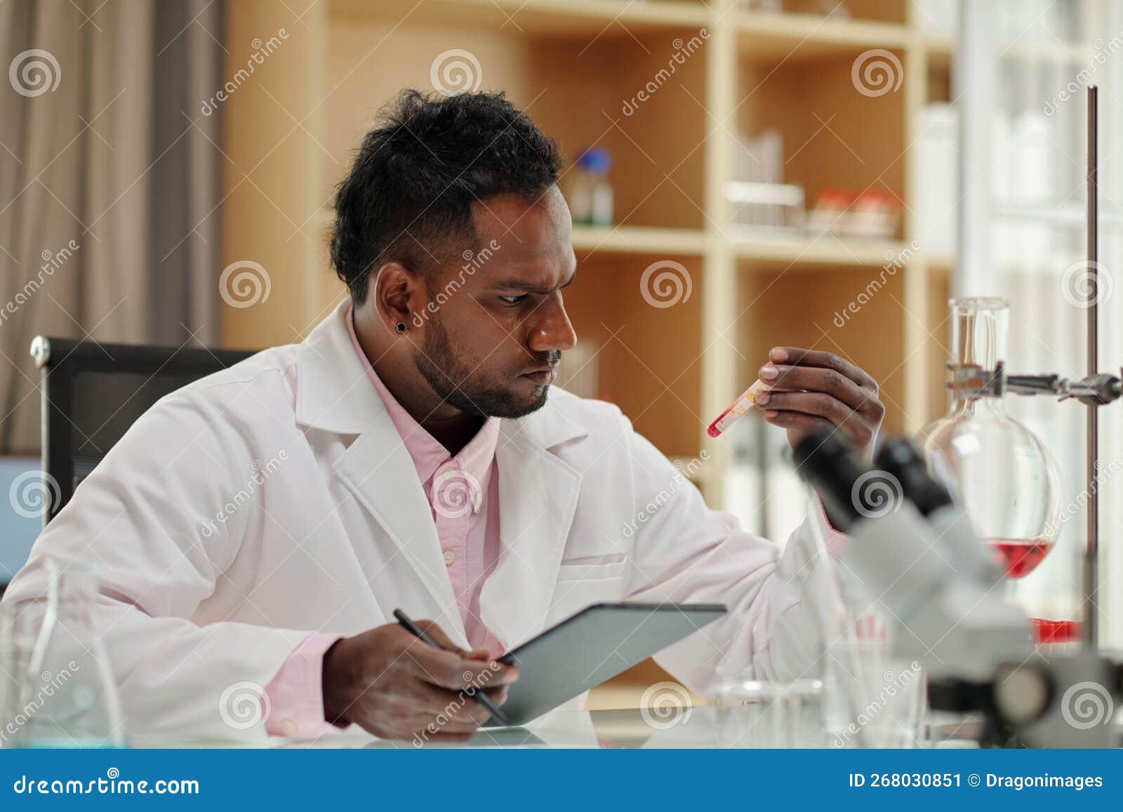 Examining Blood Samples stock image. Image of examining - 268030851