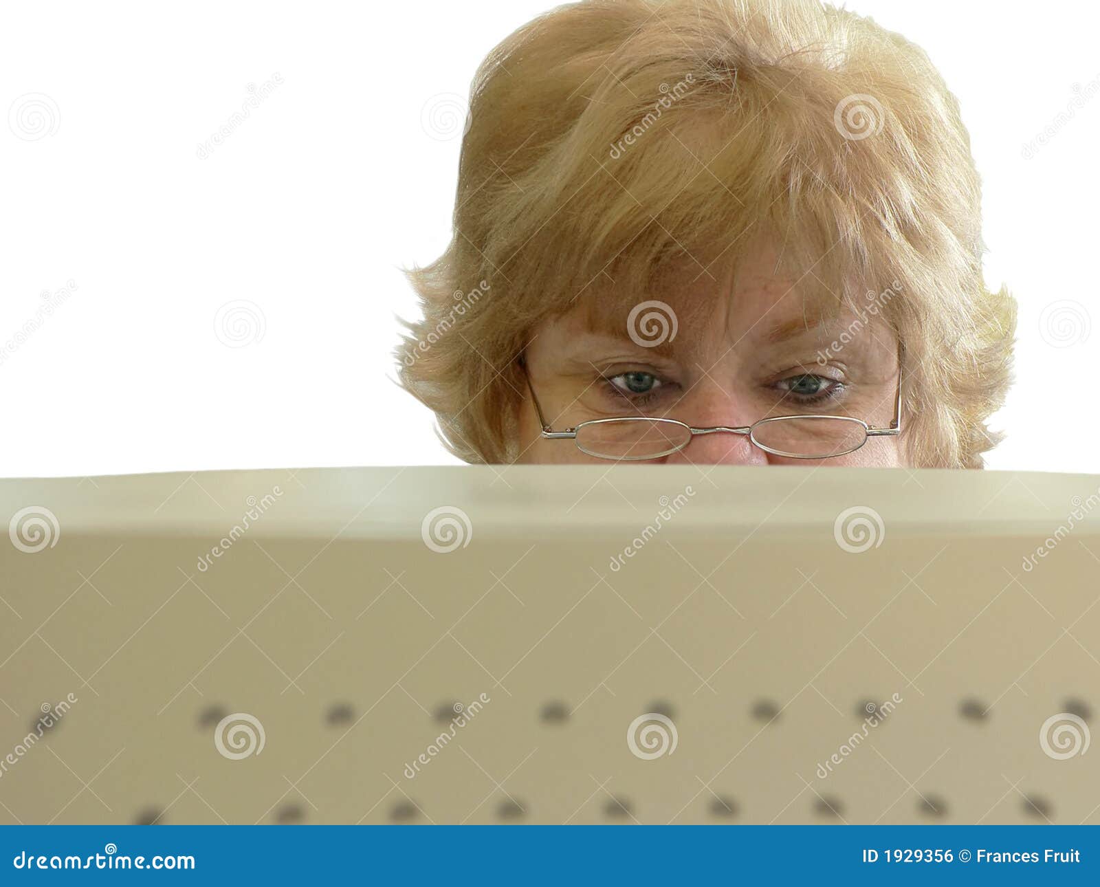 Frowning Woman Looking at Computer Stock Photo - Image of senior ...