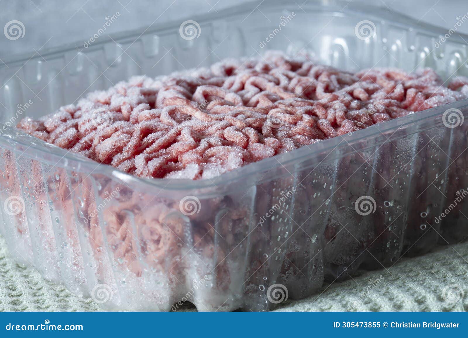 Frozen Beef Steak Mince in a Plastic Container Defrosting. Stock Image ...