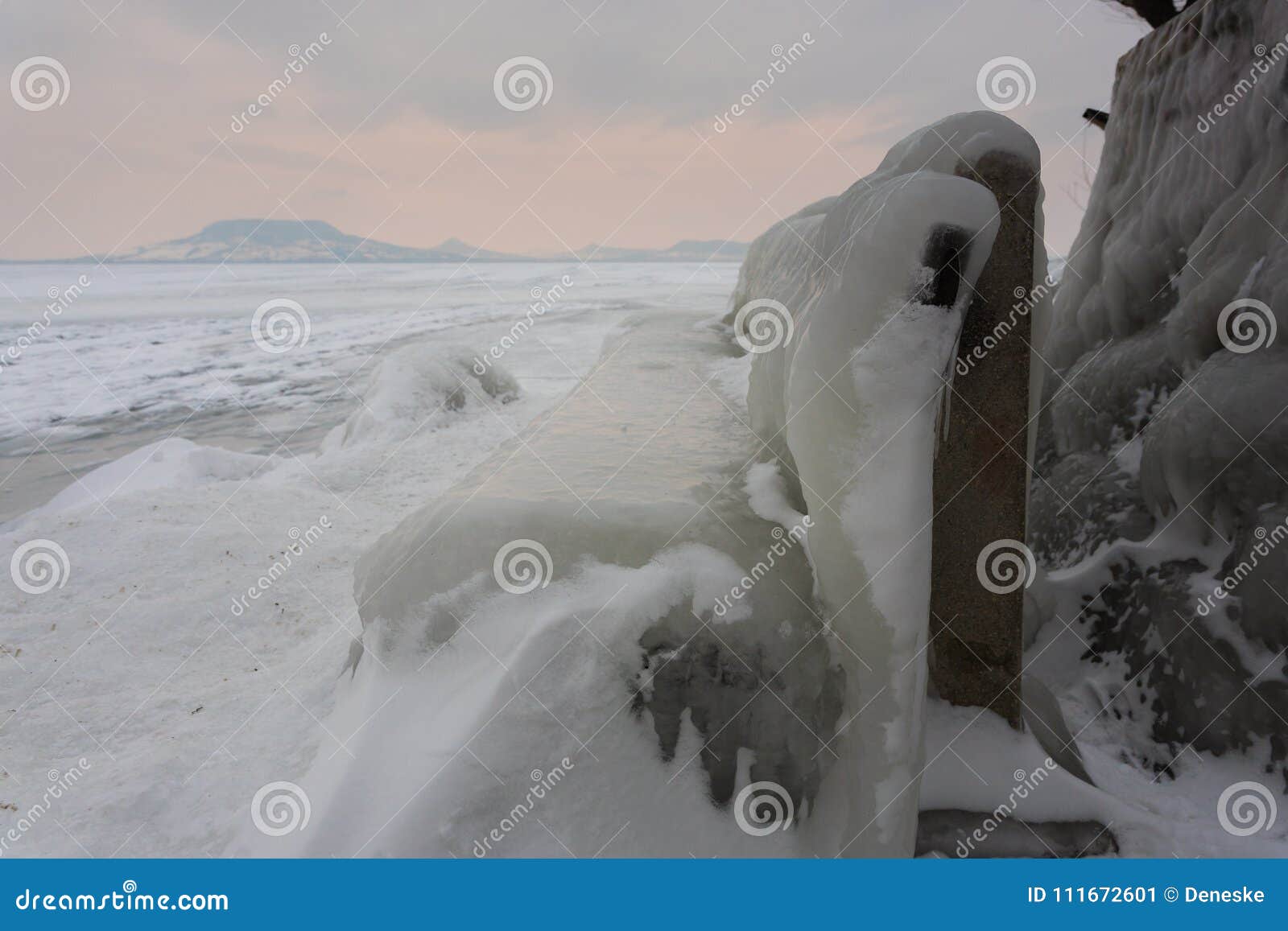 Frozen bench on the shore stock image. Image of peaceful - 111672601