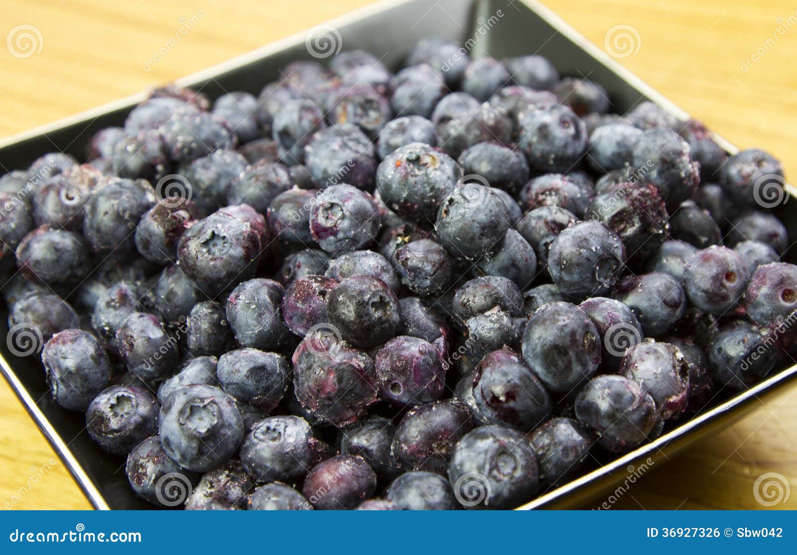 Frozen Blueberries stock photo. Image of wood, bowl, stain - 36927326