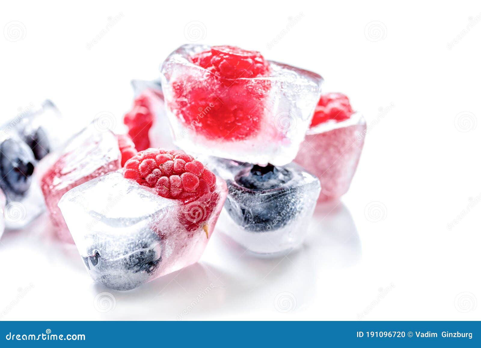 Frozen Blueberry and Raspberry in Ice Cubes on White Background Stock ...