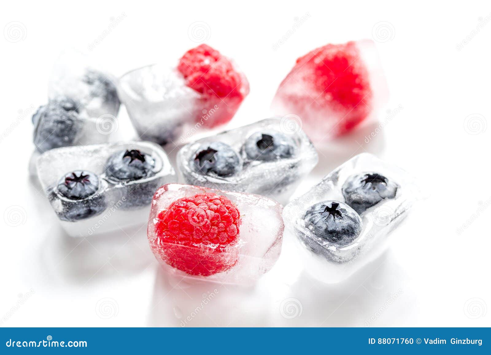 Frozen Blueberry and Raspberry in Ice Cubes on White Background Stock ...