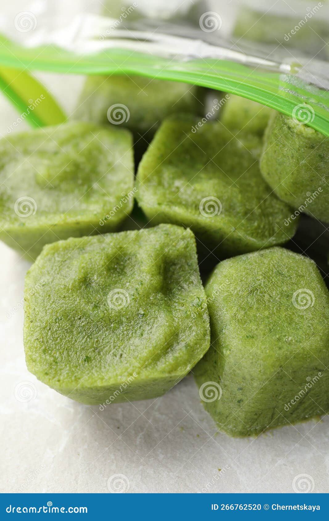 Frozen Broccoli Puree Cubes in Plastic Bag on Table, Closeup Stock ...