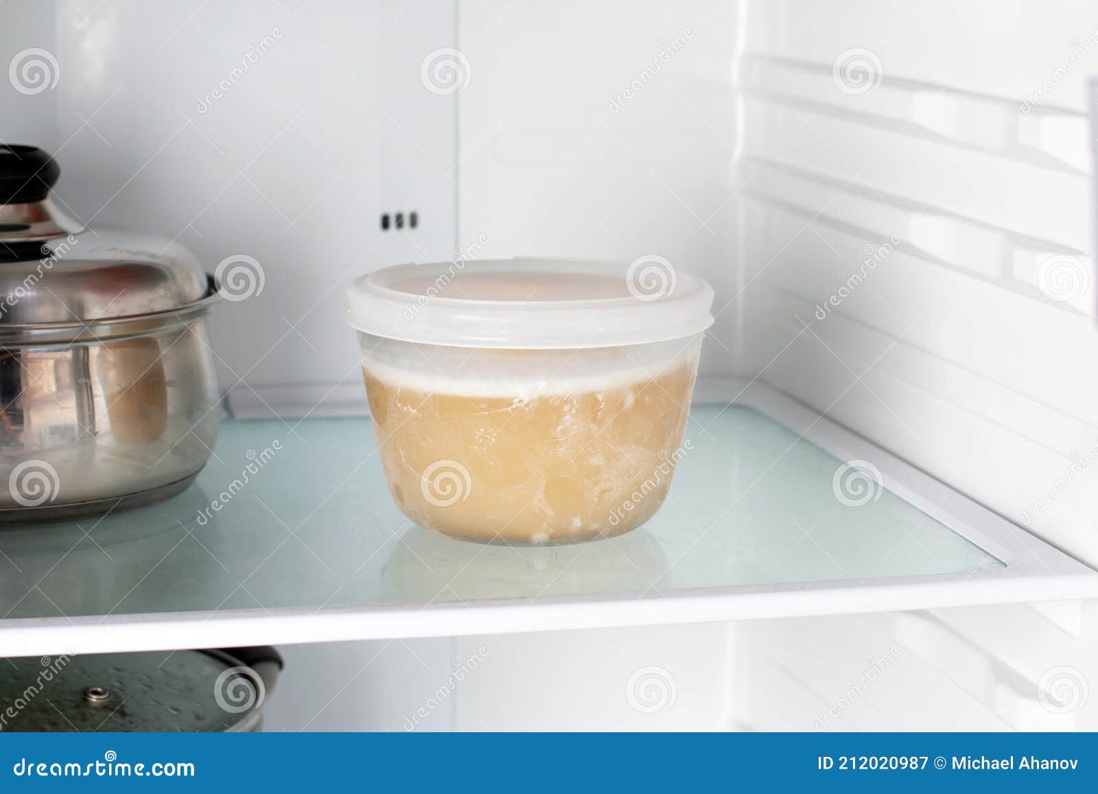Frozen Broth in a Container in the Freezer Stock Image - Image of ...