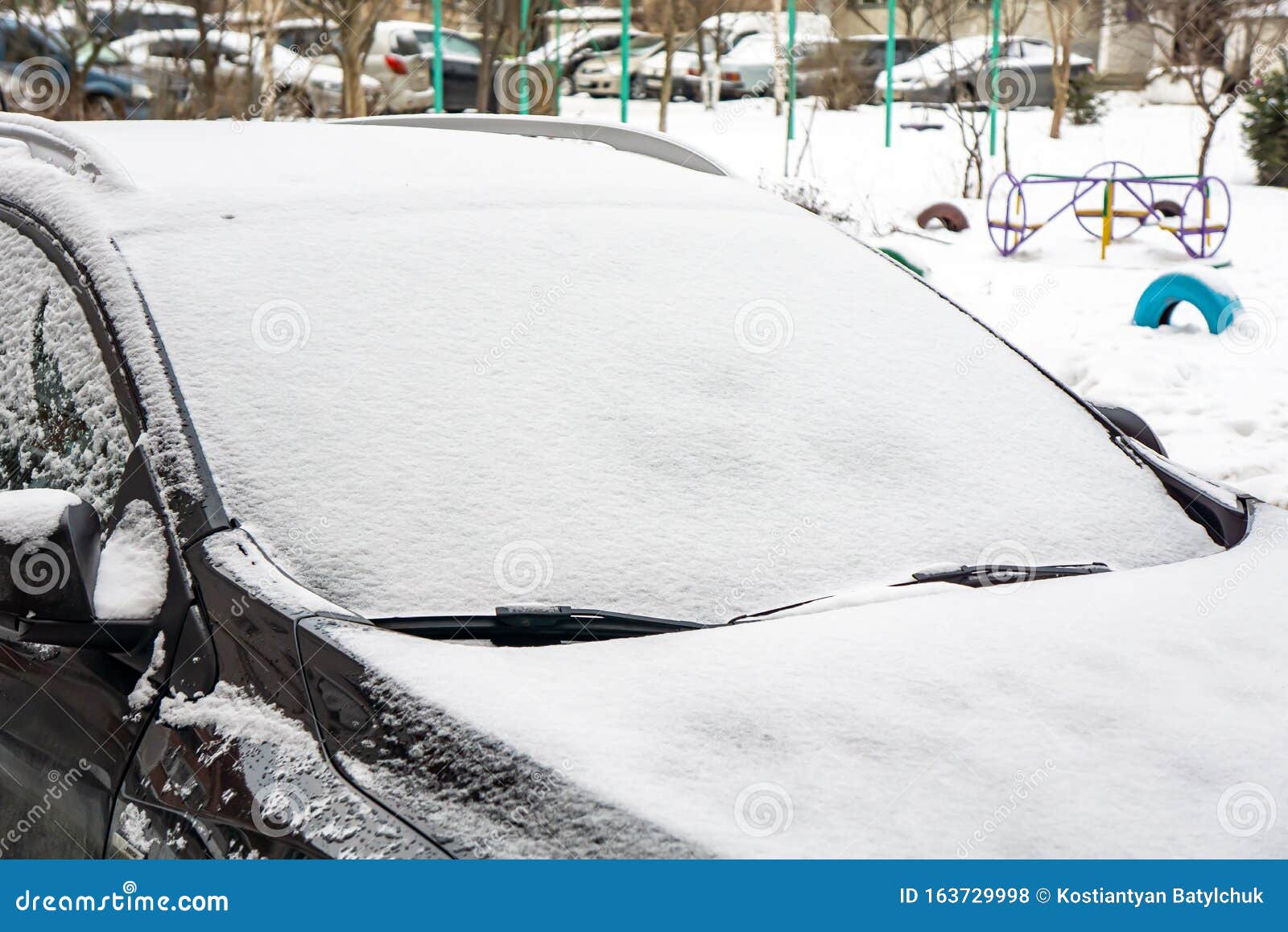 A Frozen Car Windshield is Covered in Ice and Snow on a Winter Day ...