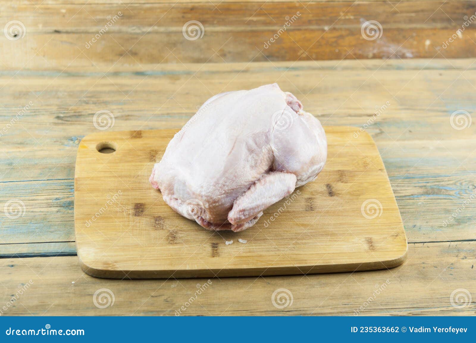 Frozen Chicken Carcass on Wooden Chopping Board Stock Photo - Image of ...