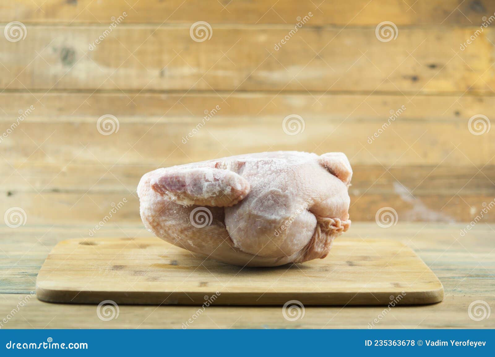 Frozen Chicken Carcass on Wooden Chopping Board Stock Photo - Image of ...