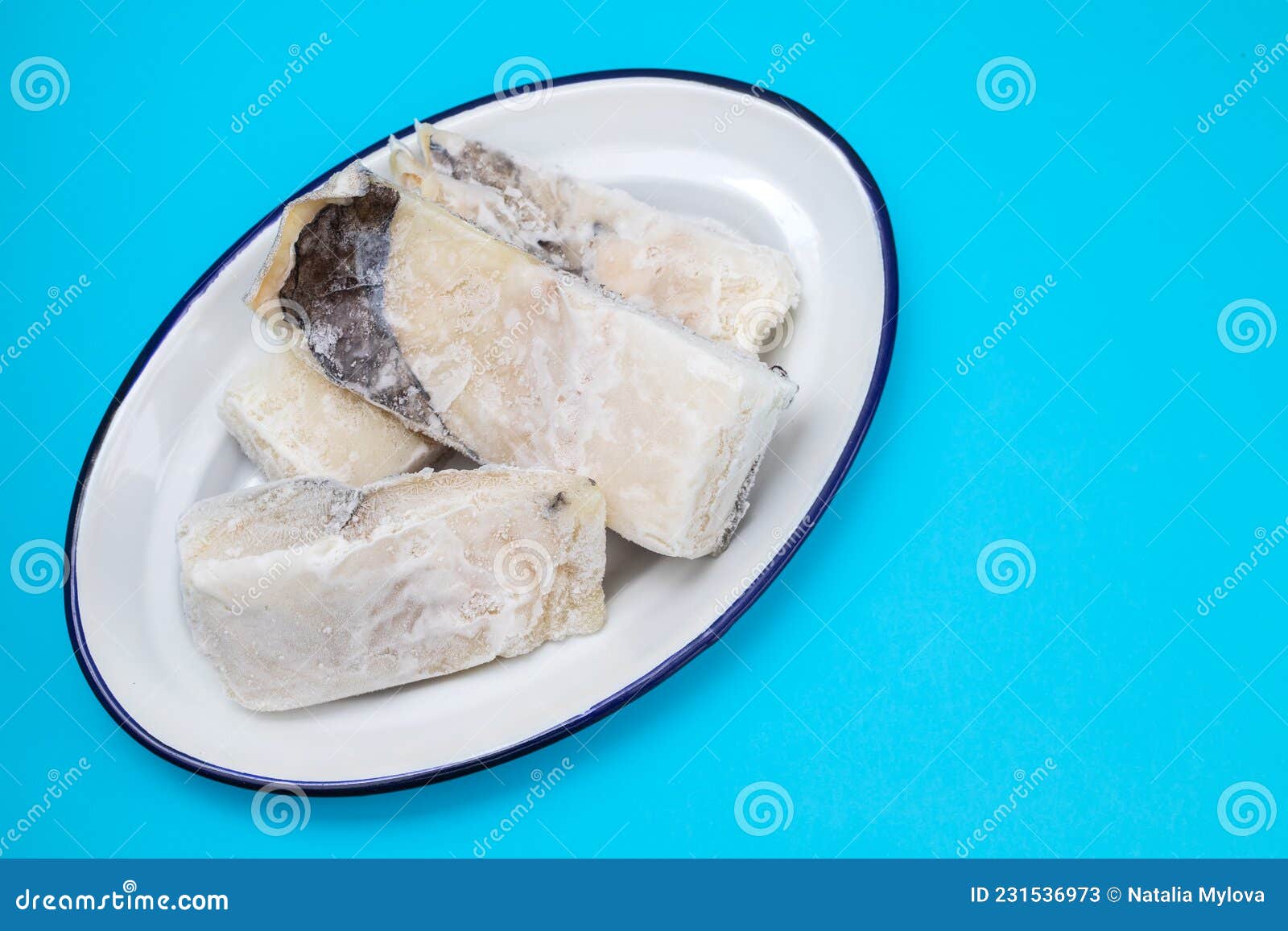 Frozen Cod Fish on White Dish on Blue Background Stock Image - Image of ...