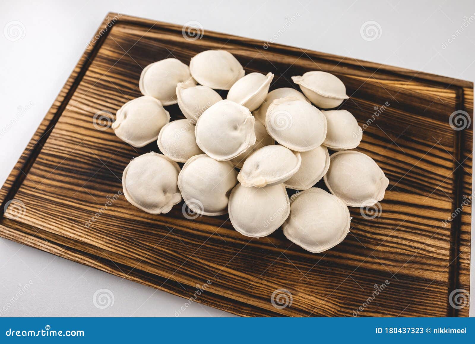 Frozen Dumplings on a Wooden Board. Stock Image - Image of delicious ...