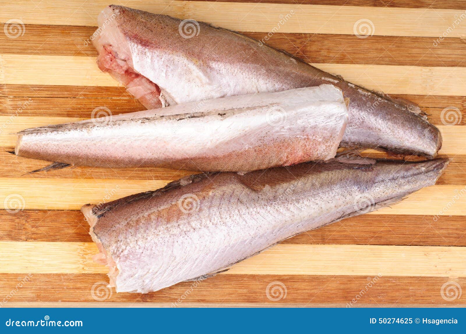 Frozen Fish Hake on Cutting Board Stock Image - Image of background ...