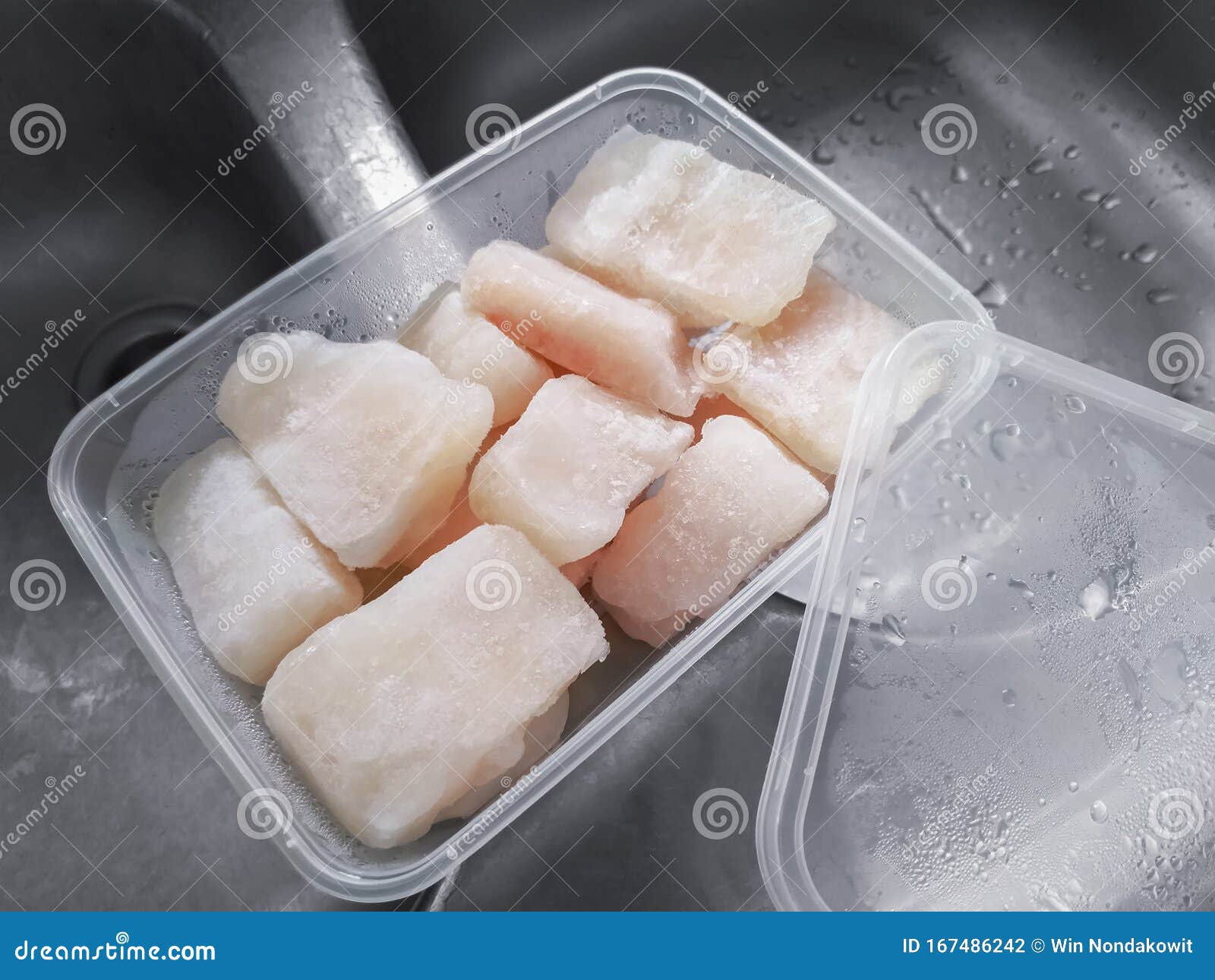 Frozen fish in plastic box stock photo. Image of plastic - 167486242