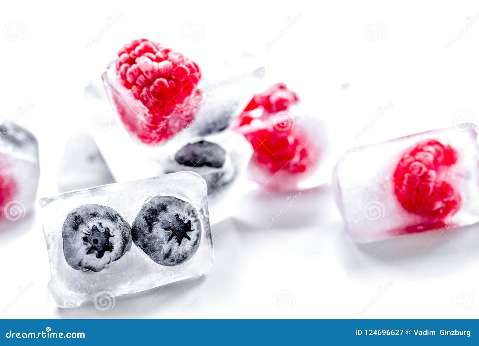 Fresh Blueberry and Raspberry in Ice on Table Background Stock Image ...