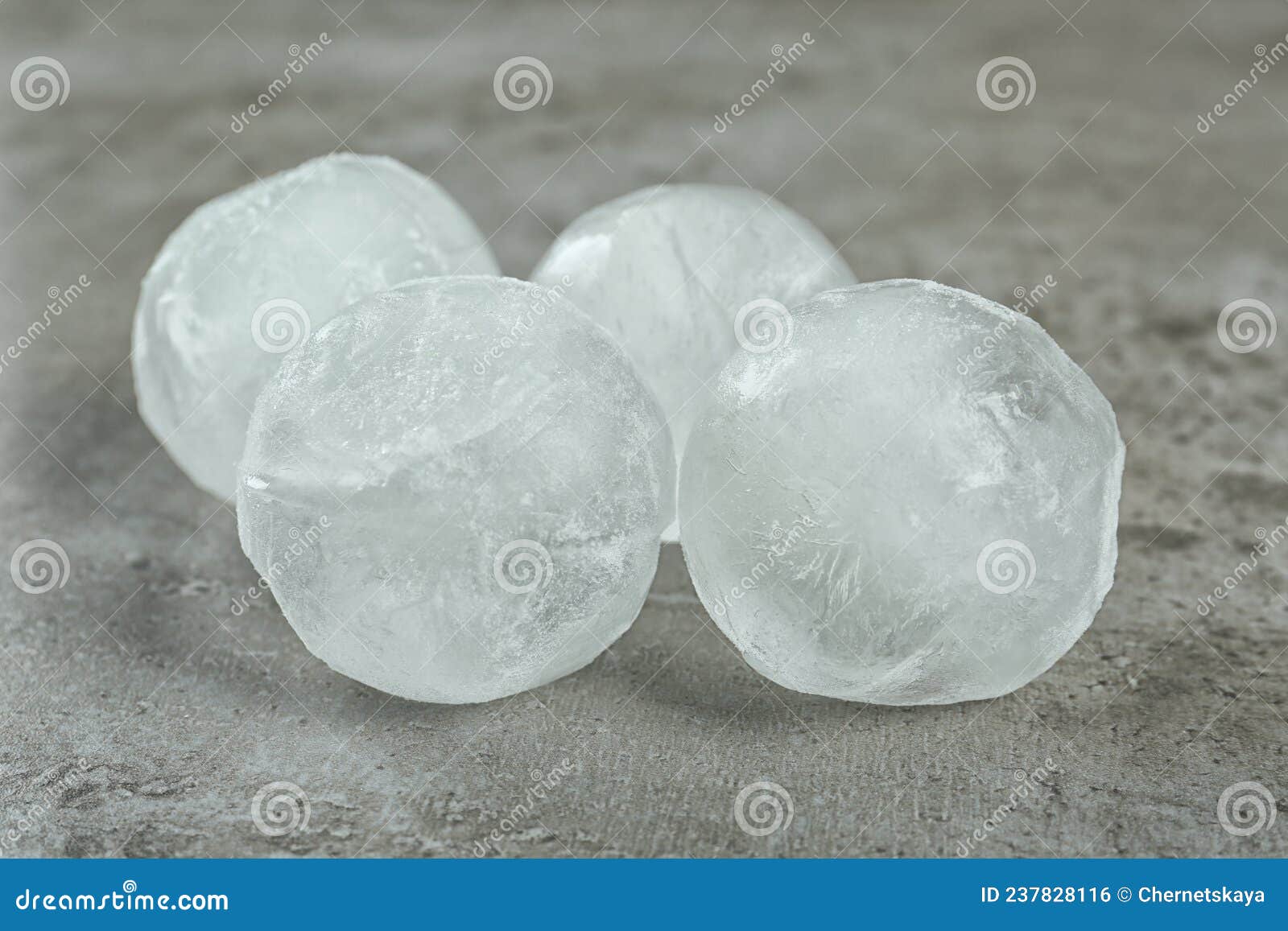 Frozen Ice Balls on Grey Table, Closeup Stock Photo - Image of cube ...