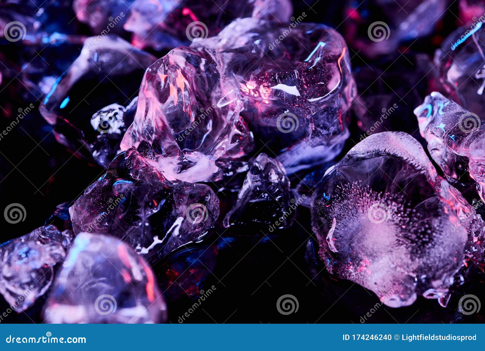 Frozen Ice Cubes with Purple Lighting Isolated on Black. Stock Photo ...