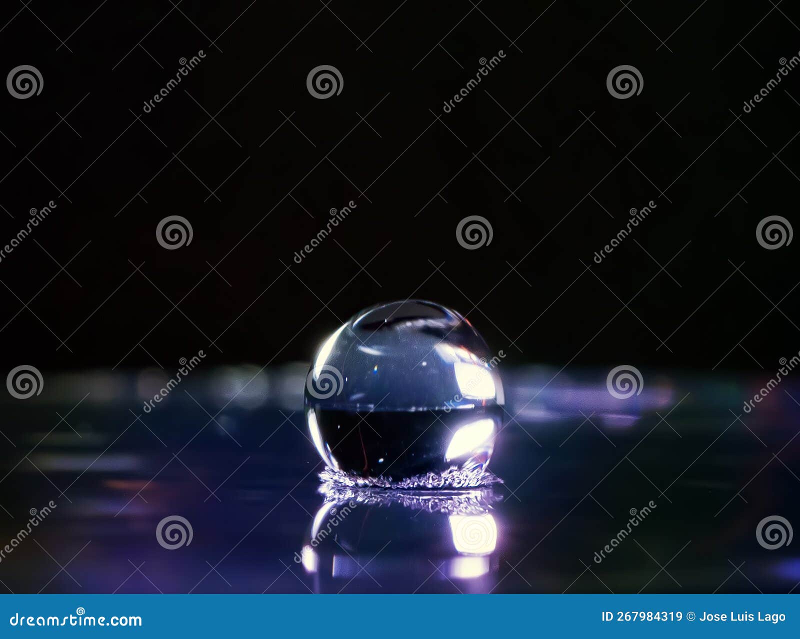 Frozen Instant in Which the Falling Drop Enters the Liquid. Foreground ...