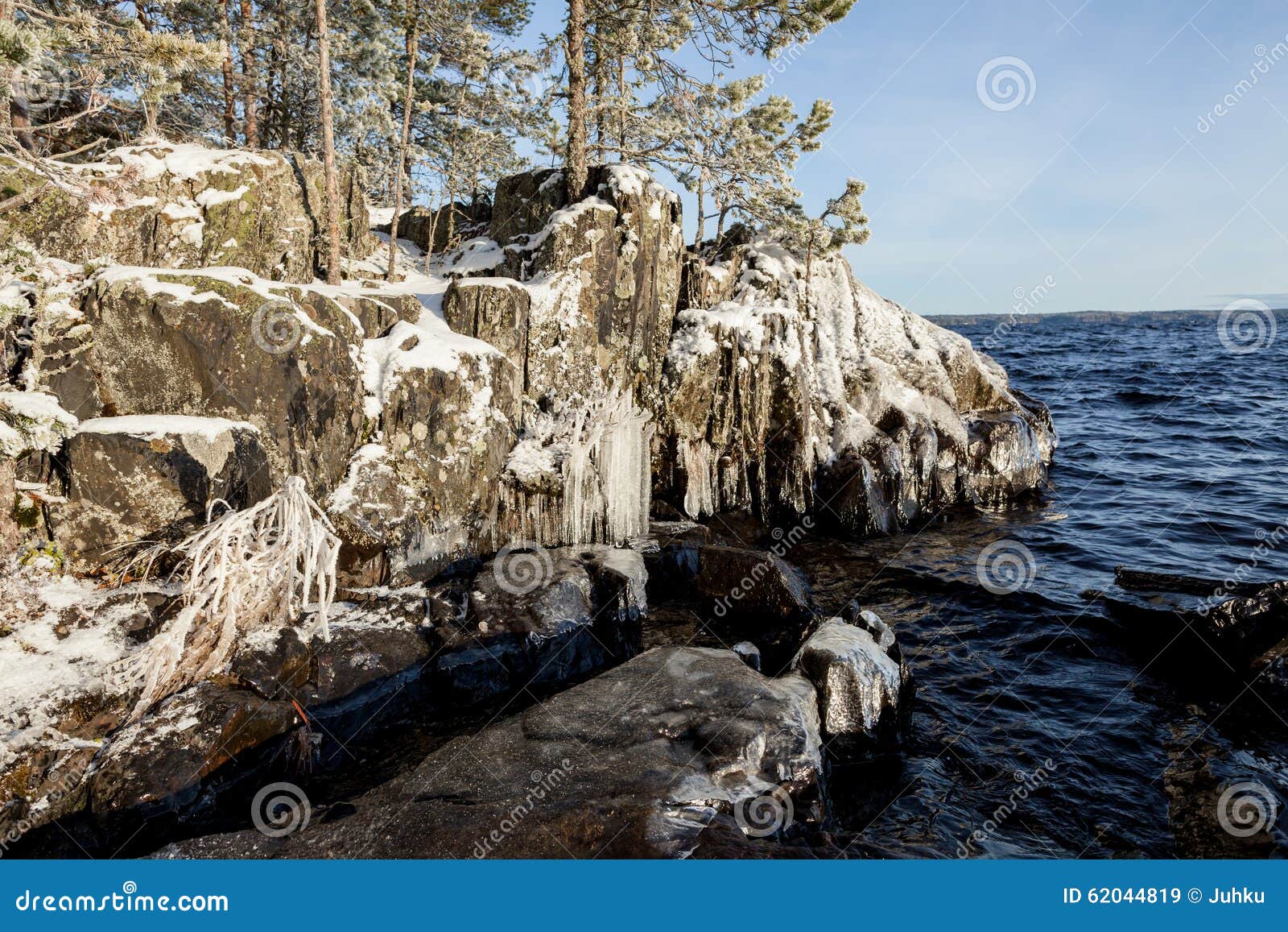Frozen Lakefront Rock Cliff Stock Image - Image of magnificent, icicle ...