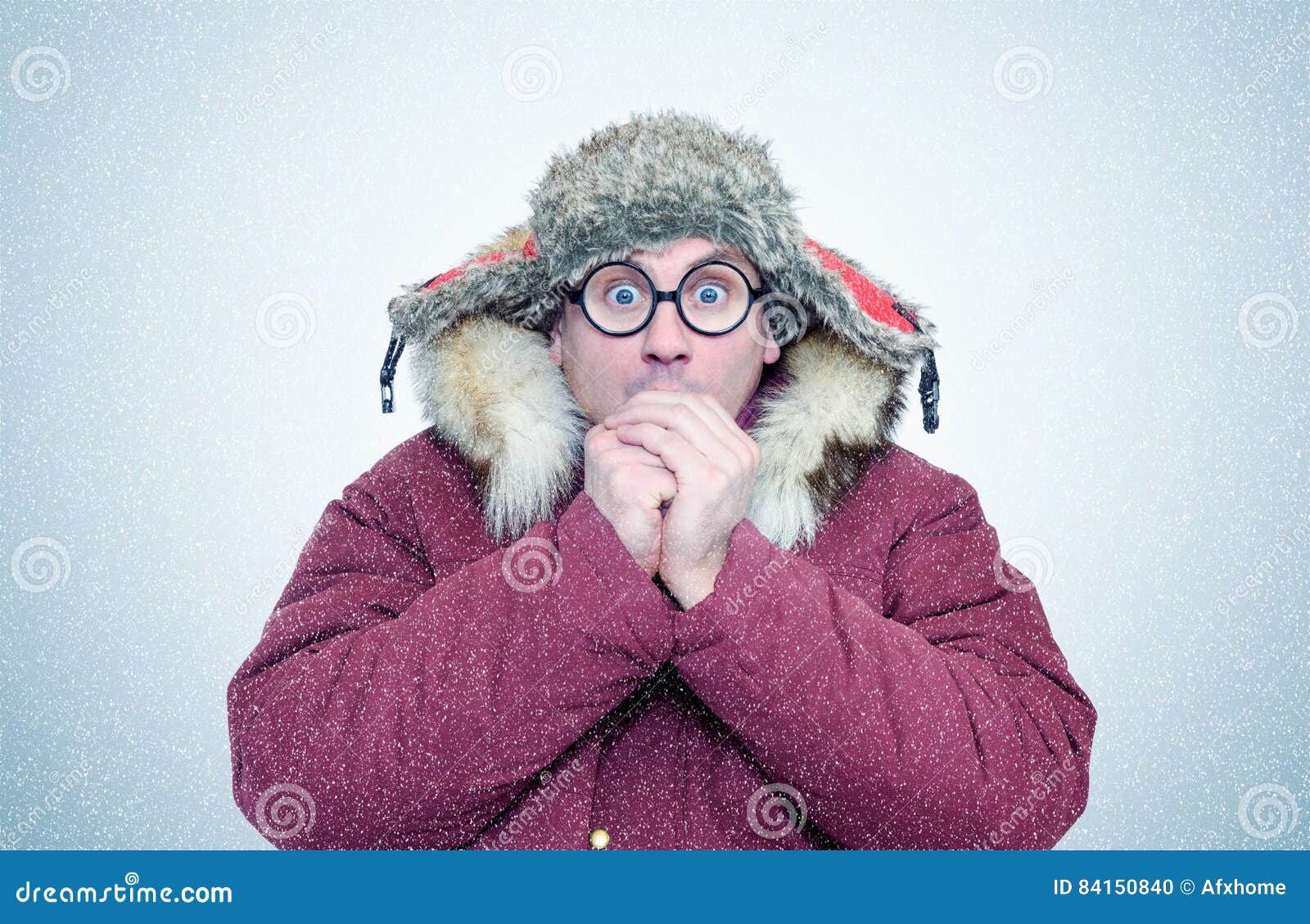 Frozen Man in Winter Clothes and Glasses Warming Hands, Cold, Snow ...