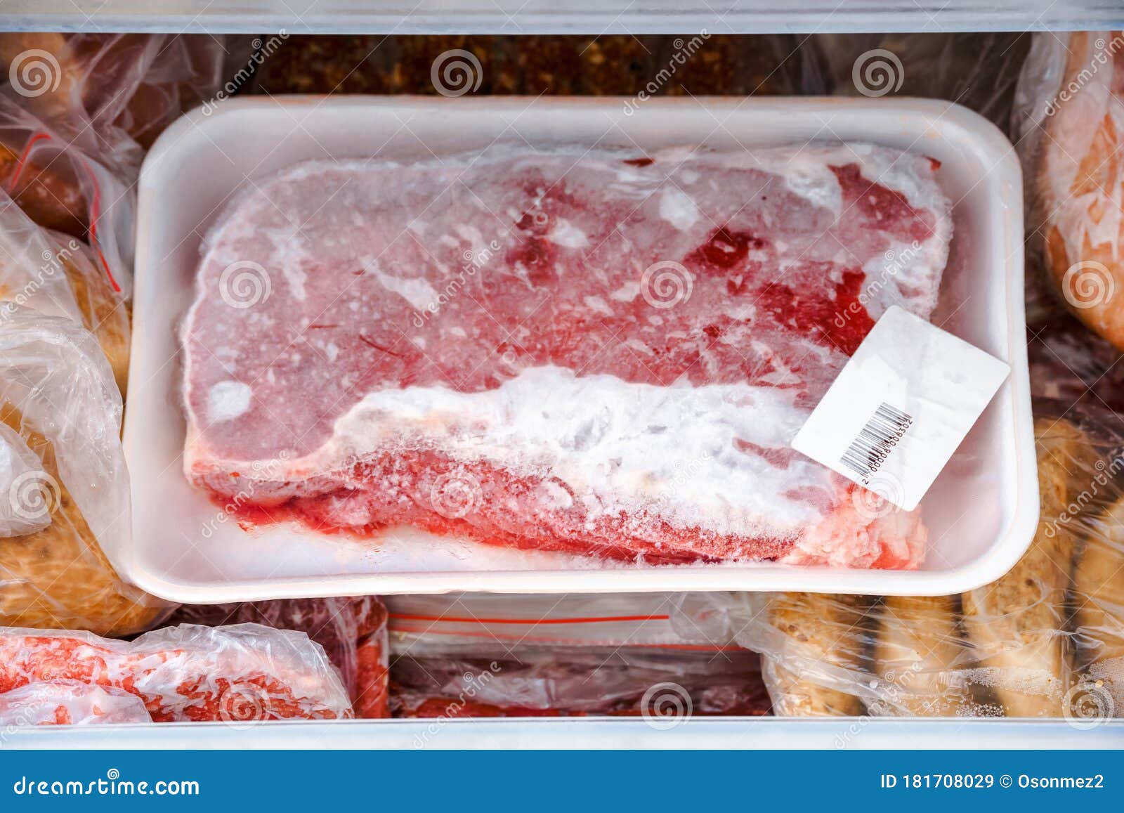 Frozen Meat and Other Foods in the Fridge Freezer Compartment Stock ...