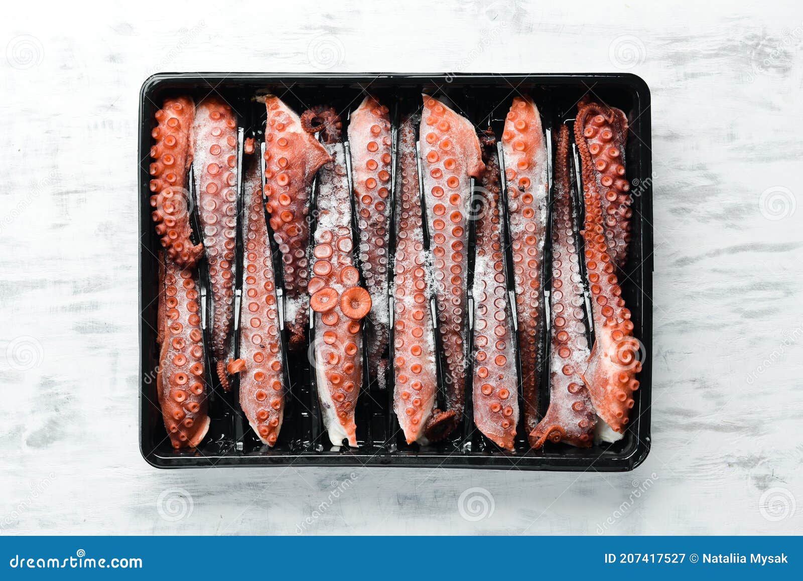 Frozen Octopus Tentacles in a Plastic Box. Stock Image - Image of ...