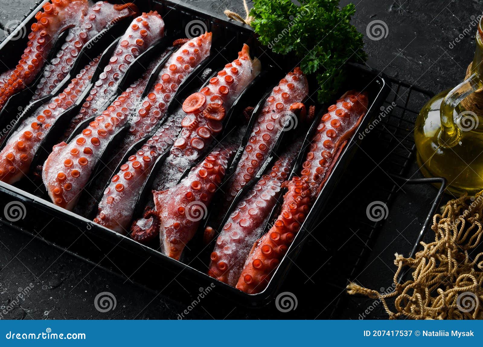 Frozen Octopus Tentacles in a Plastic Box. Stock Image - Image of ...