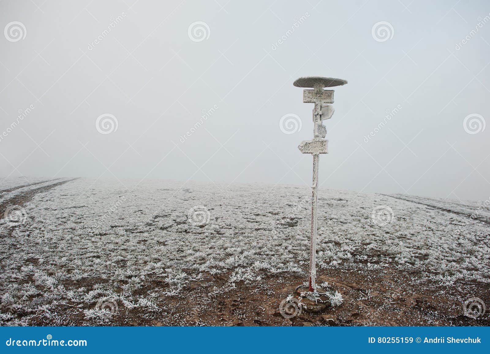 Frozen Pointer with Directional Arrows at Mountains Stock Image - Image ...