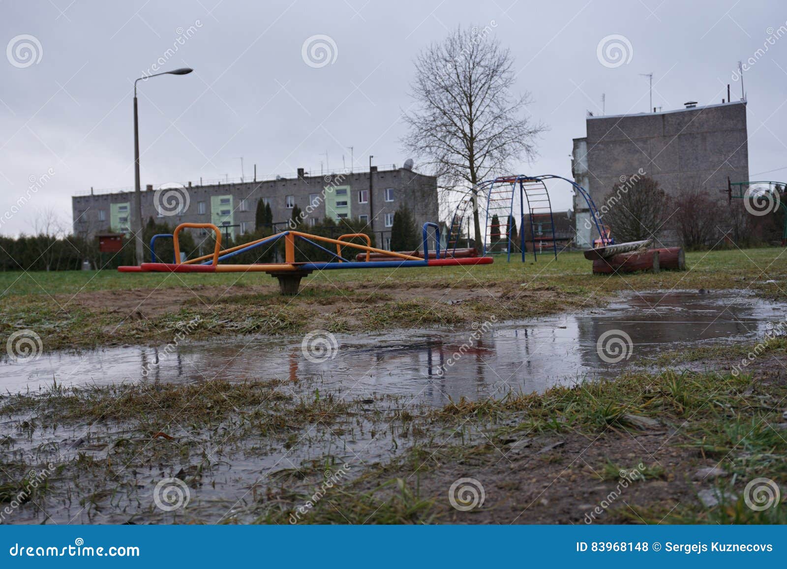 Frozen Puddle on the Playground Stock Photo - Image of autumn, tree ...