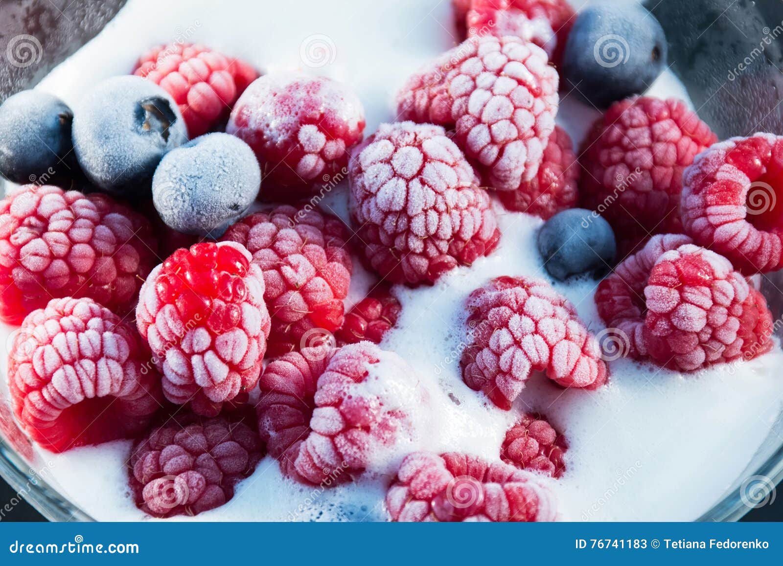 Frozen Raspberry and Blueberry with Ice Cream in a Glass Bowl Stock ...