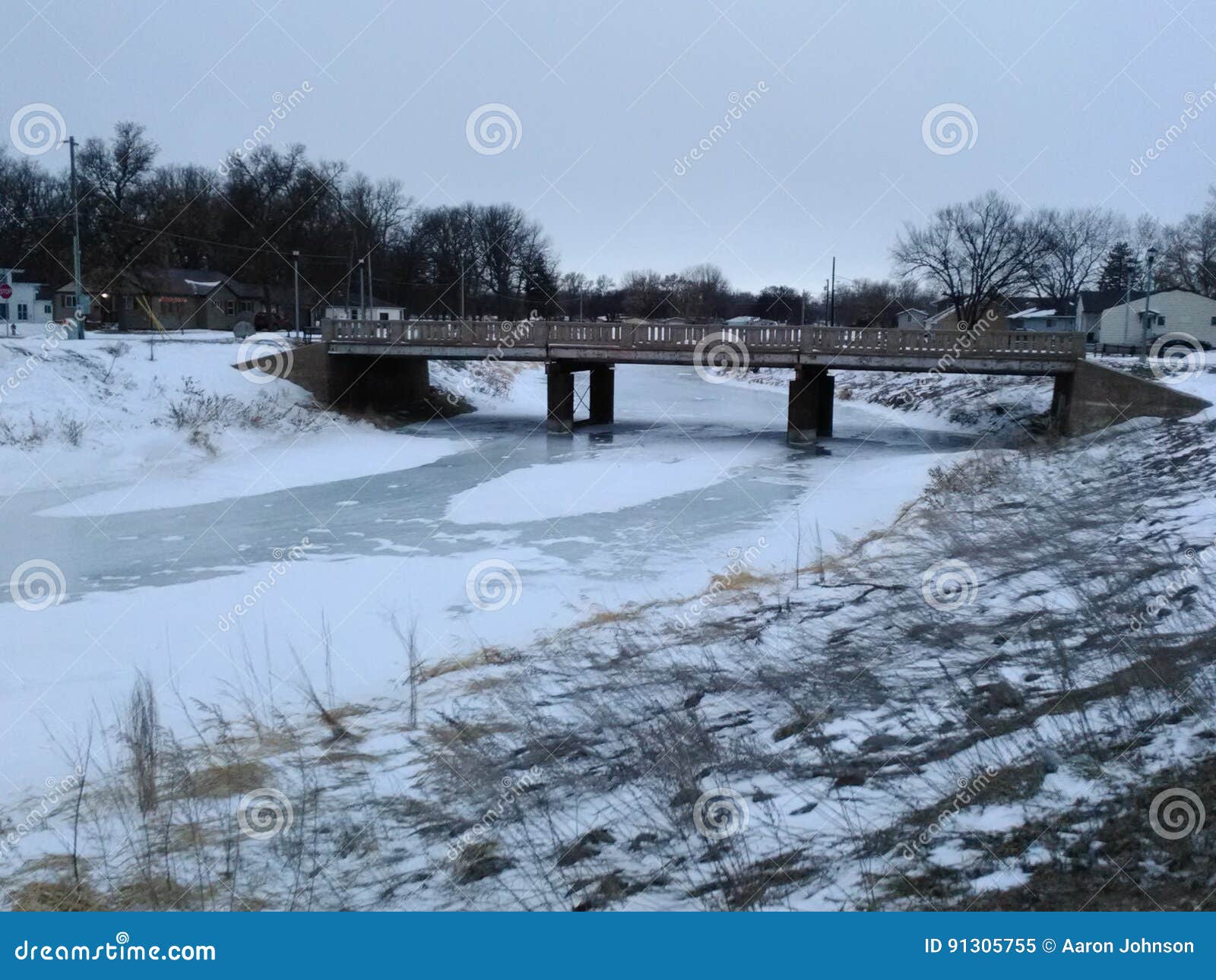 Frozen River and a Bridge stock image. Image of scene - 91305755