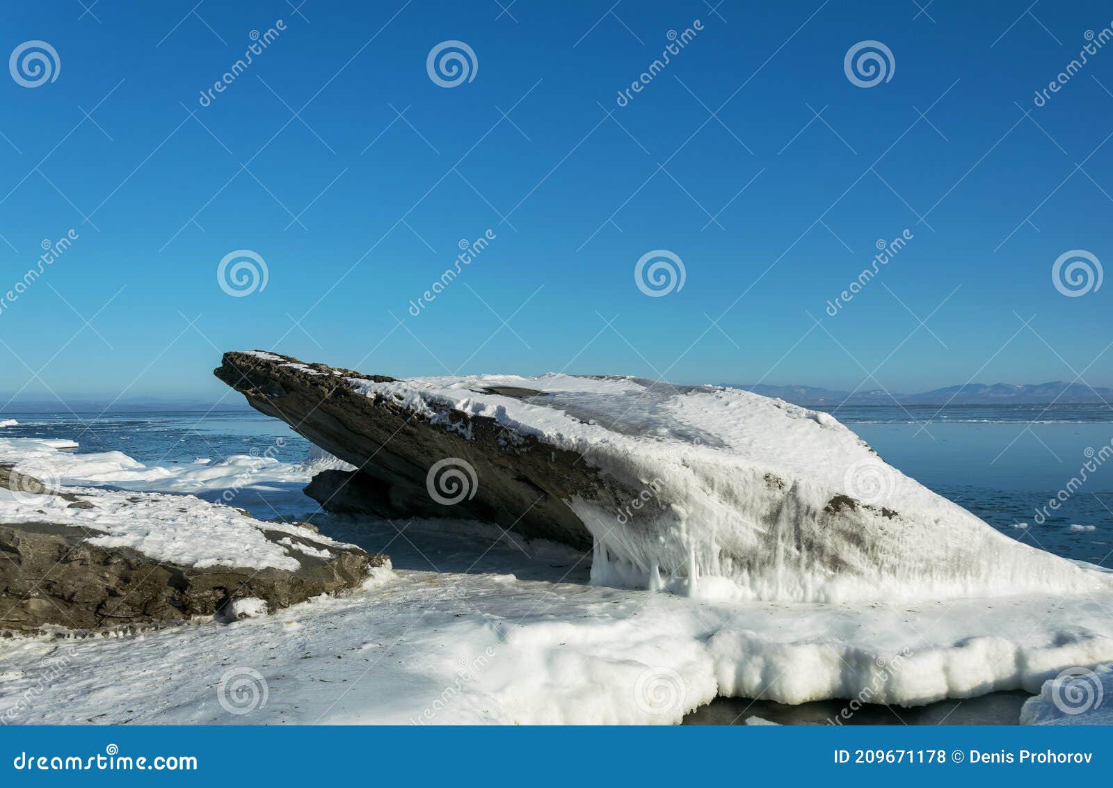 Frozen Rocks in the Sea on a Sunny Winter Day. Stock Photo - Image of ...