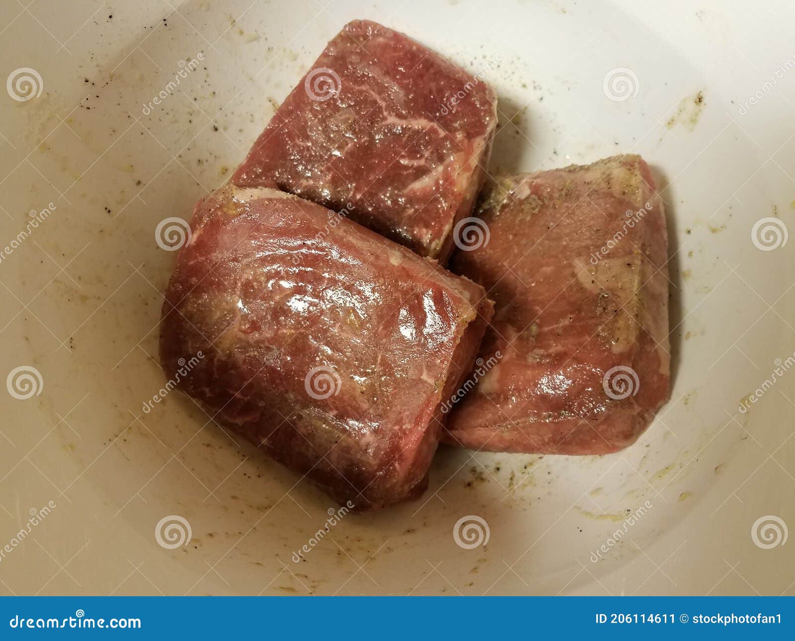 Frozen Seasoned Beef Meat Squares in White Plastic Container Stock ...