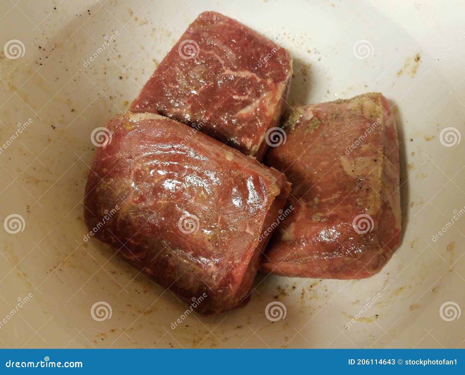 Frozen Seasoned Beef Meat Squares in White Plastic Container Stock ...
