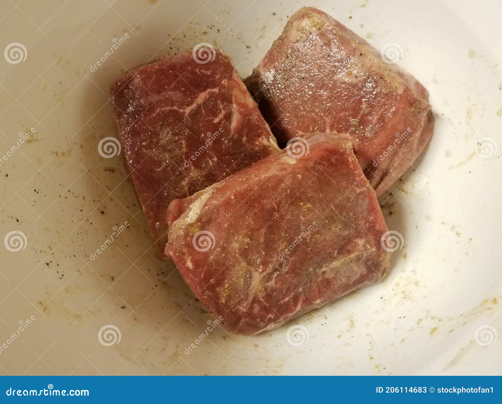 Frozen Seasoned Beef Meat Squares in White Plastic Container Stock ...