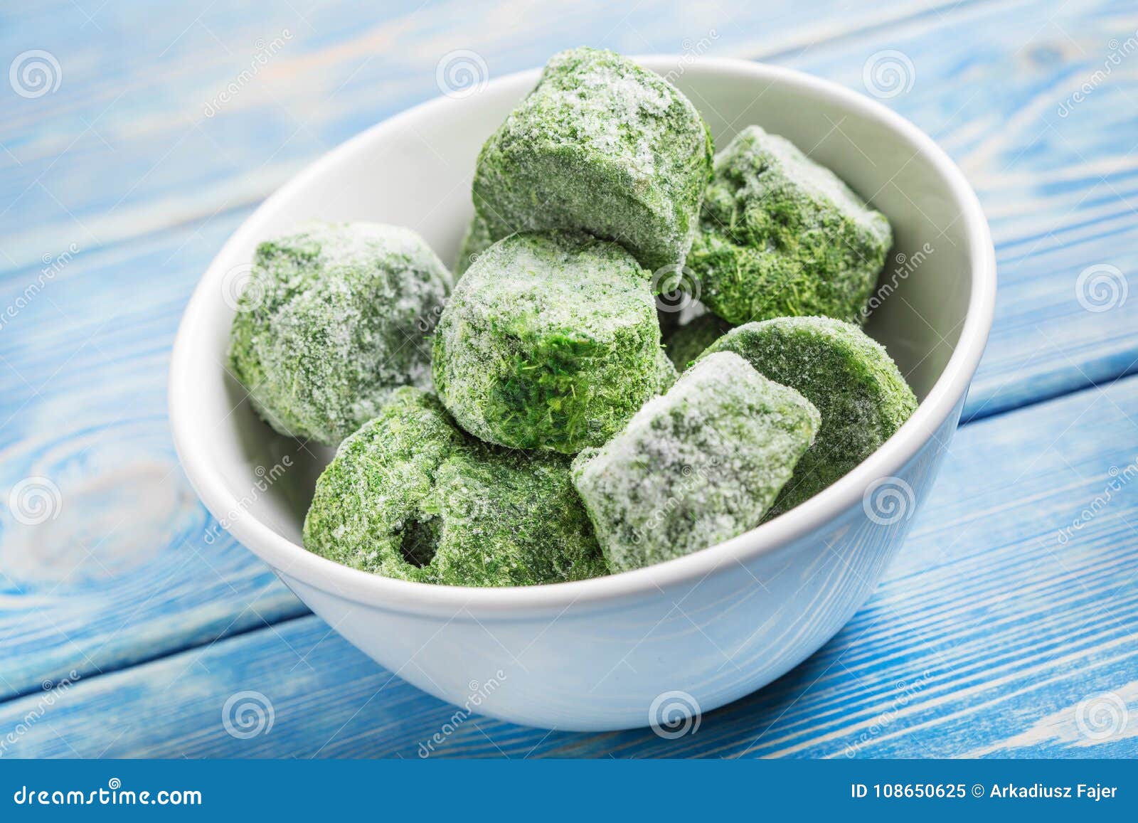Frozen spinach blocks. stock image. Image of wooden - 108650625