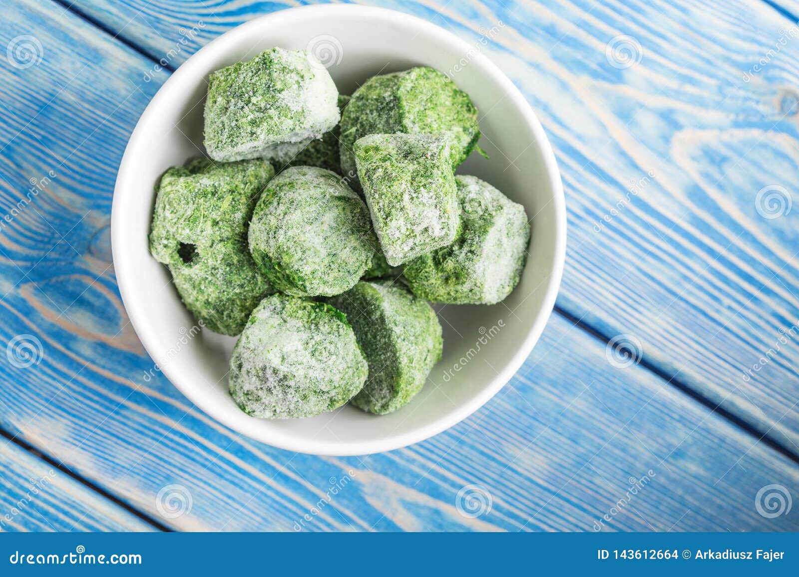 Frozen spinach blocks stock photo. Image of table, bowl - 143612664