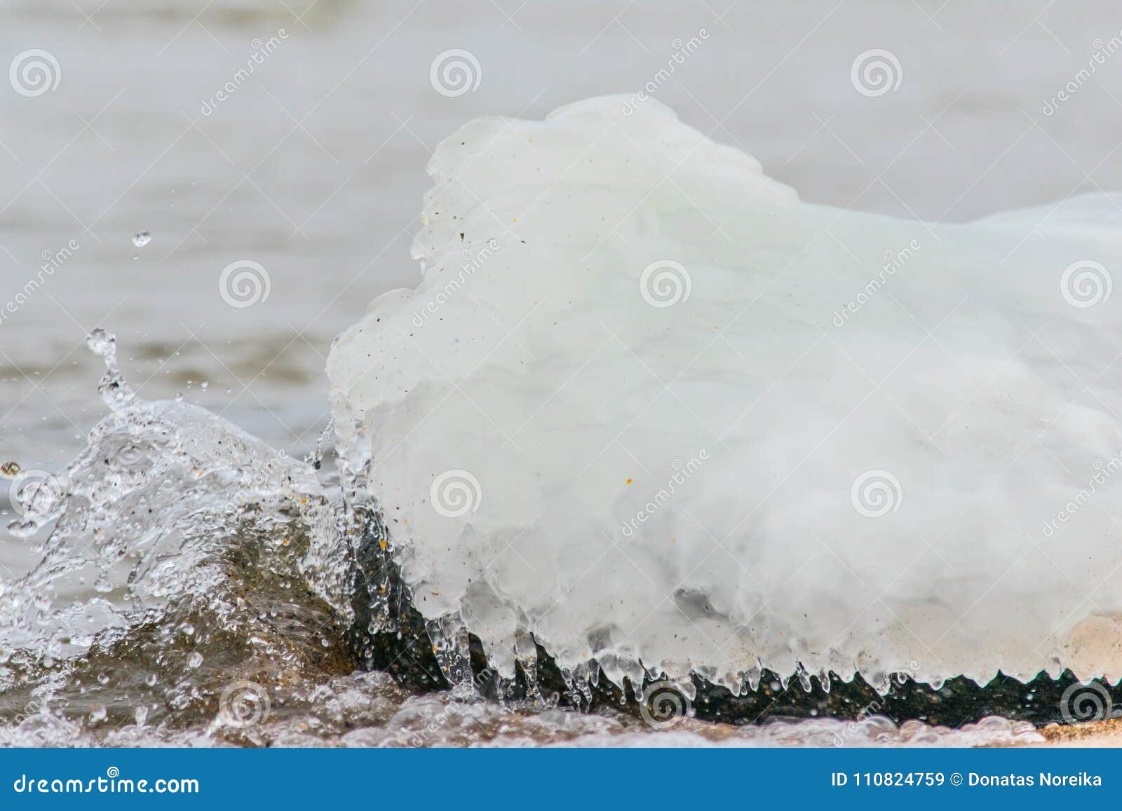 Frozen stone in water stock image. Image of splashing - 110824759