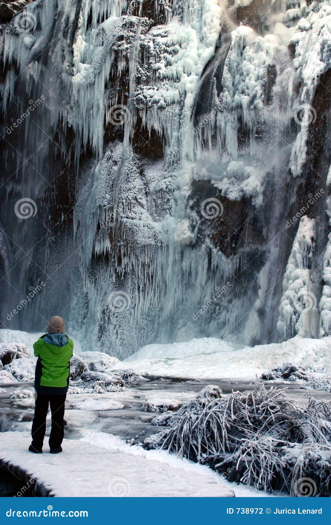 Frozen waterfall stock photo. Image of tourist, jacket - 738972