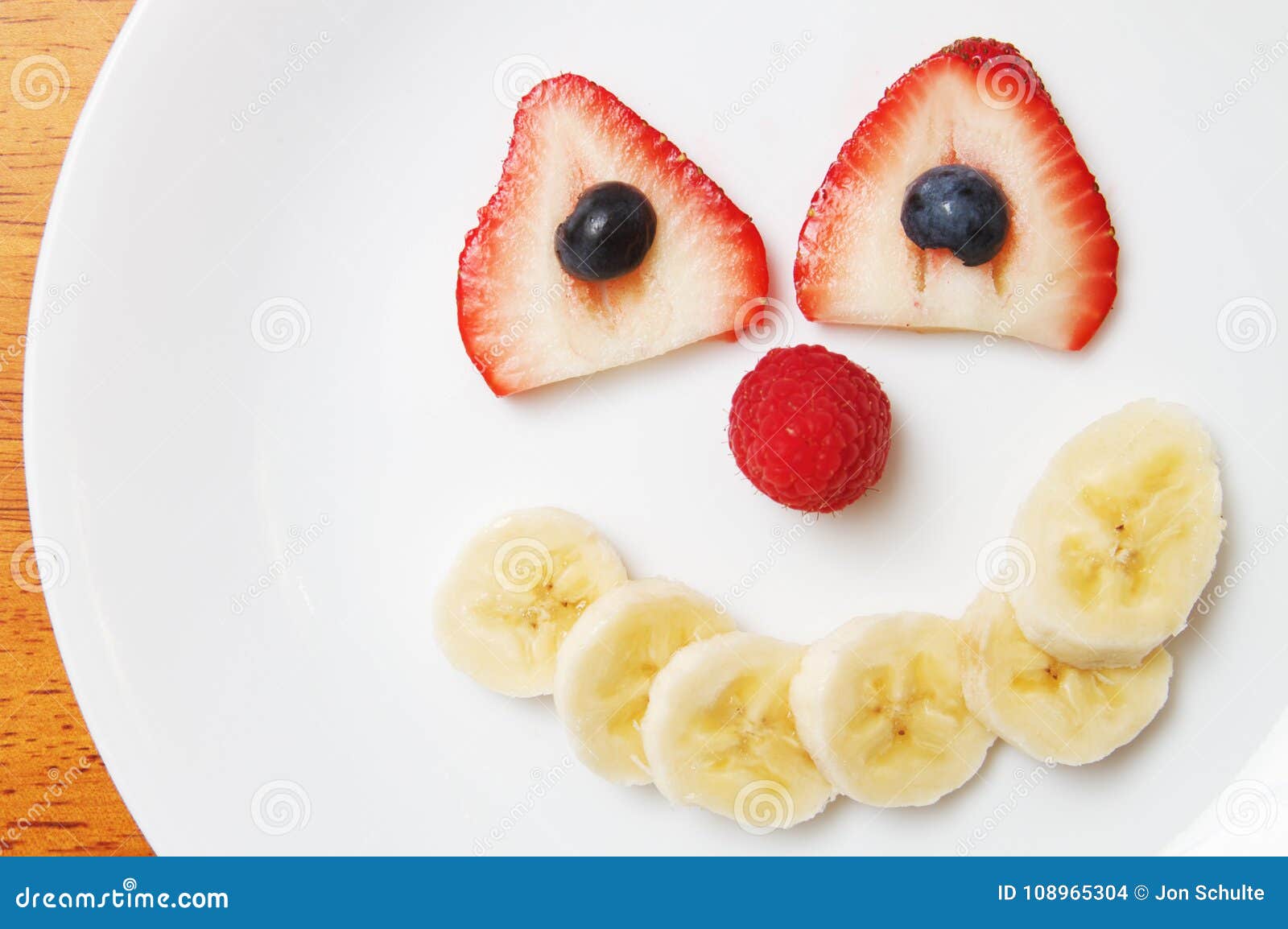 Fruit Face Plate stock photo. Image of expression, green - 108965304