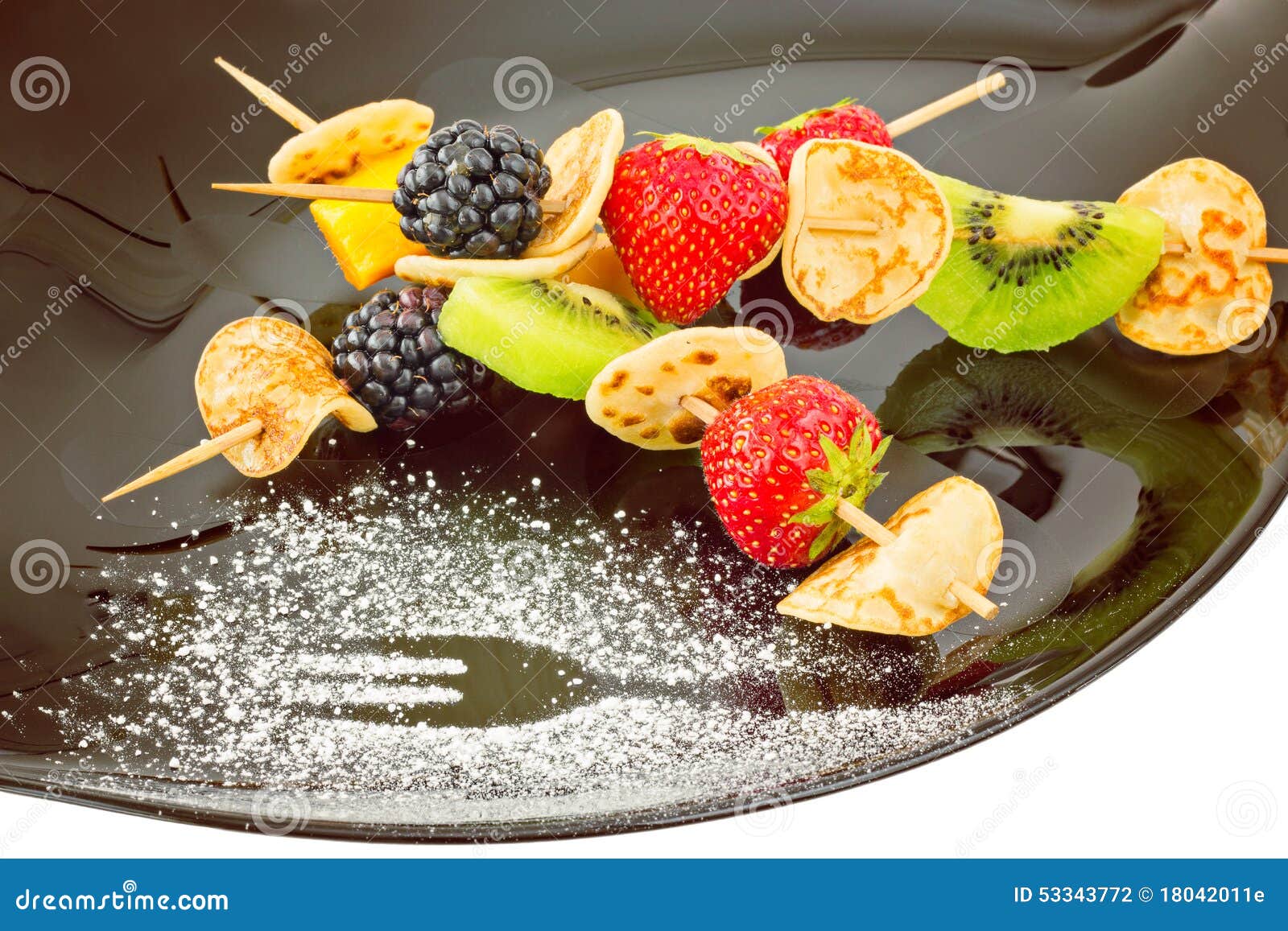 Fruit, Berries and Mini Blini Kebab on Black Plate, Dusted with Stock ...