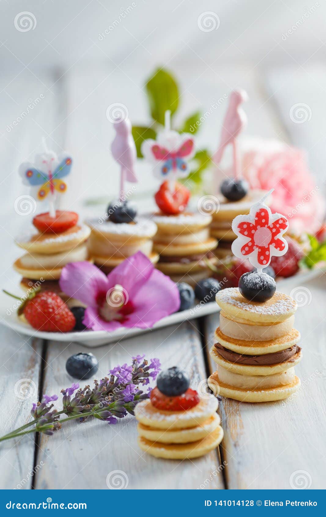 Fruit, Berry and Pancake Canapes on White Wooden Table Stock Photo ...