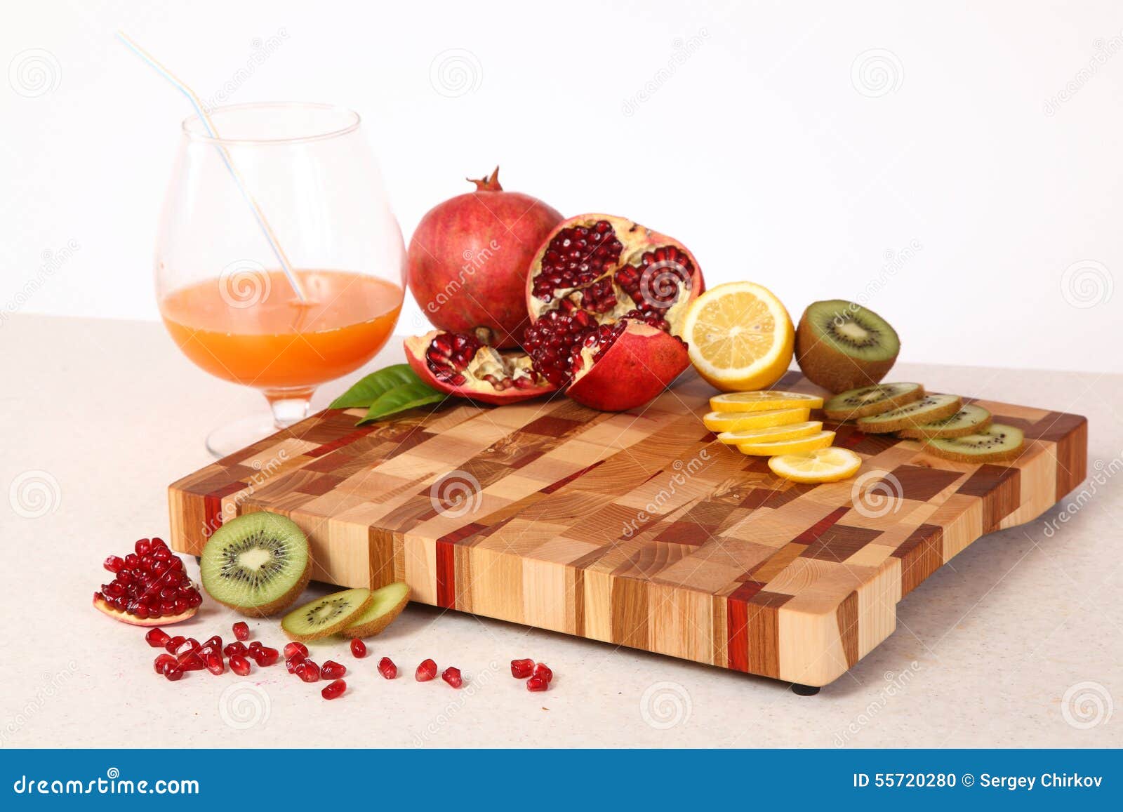 Fruit on a chopping board stock photo. Image of kiwi - 55720280