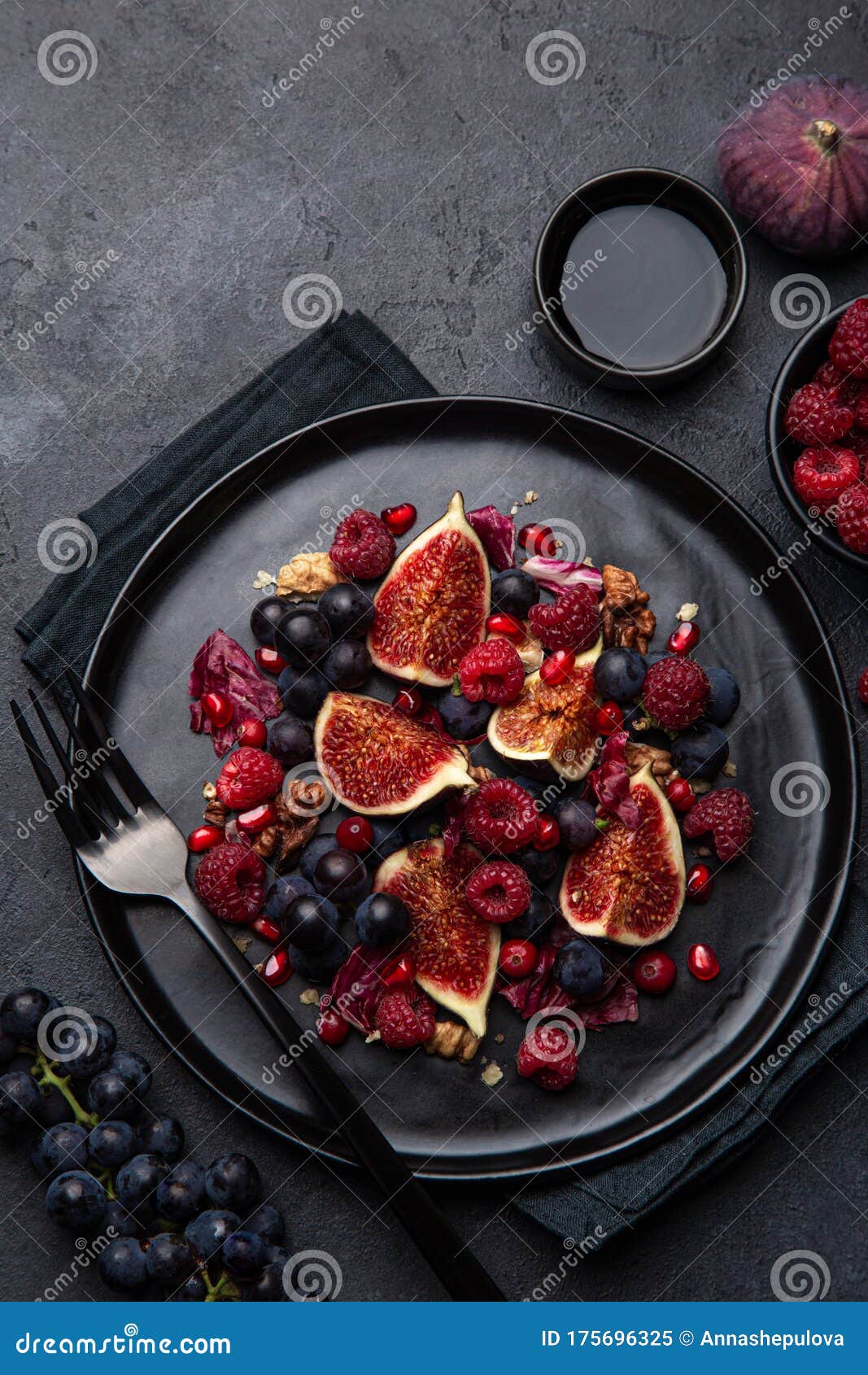 Fruit Fig, Grape, Raspberry and Pomegranate Salad on Black Plate Stock ...