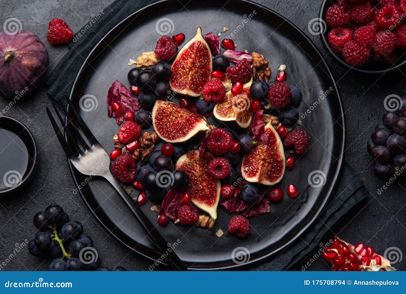 Fruit Fig, Grape, Raspberry and Pomegranate Salad on Black Plate Stock ...