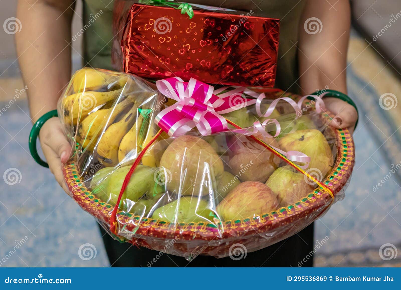 Fruit Gift Wrap Filled with Different Fruits and Gift Pack Holding at ...